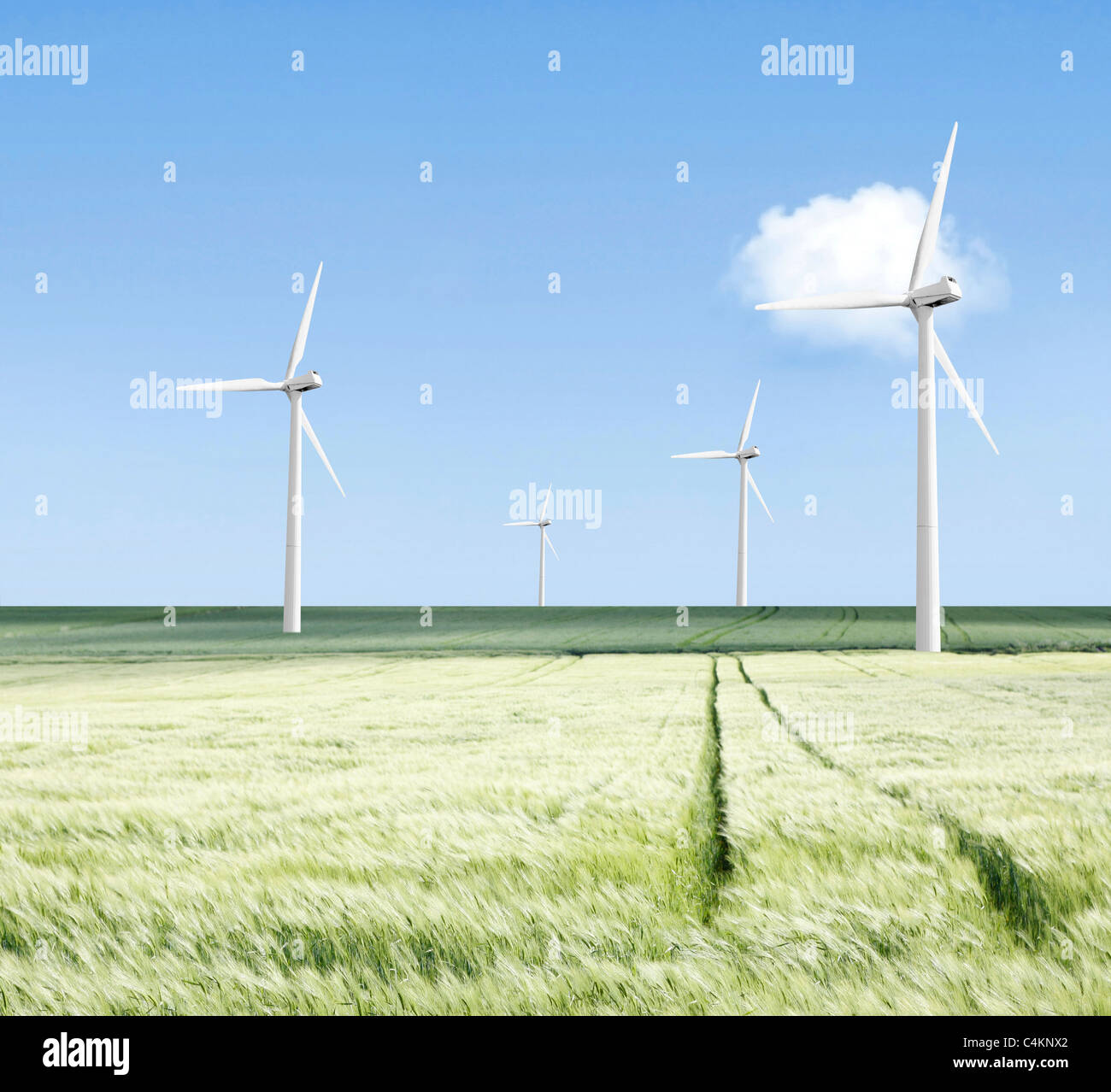 Rotating wind turbines green grass hi-res stock photography and images ...