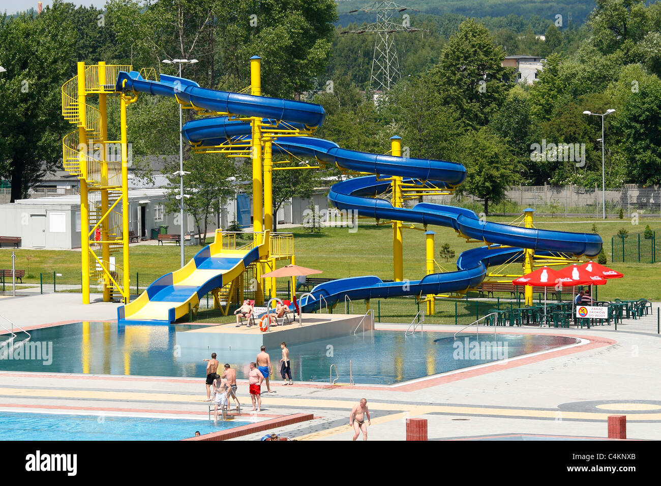 Open air swimming pool with water slide Stock Photo - Alamy