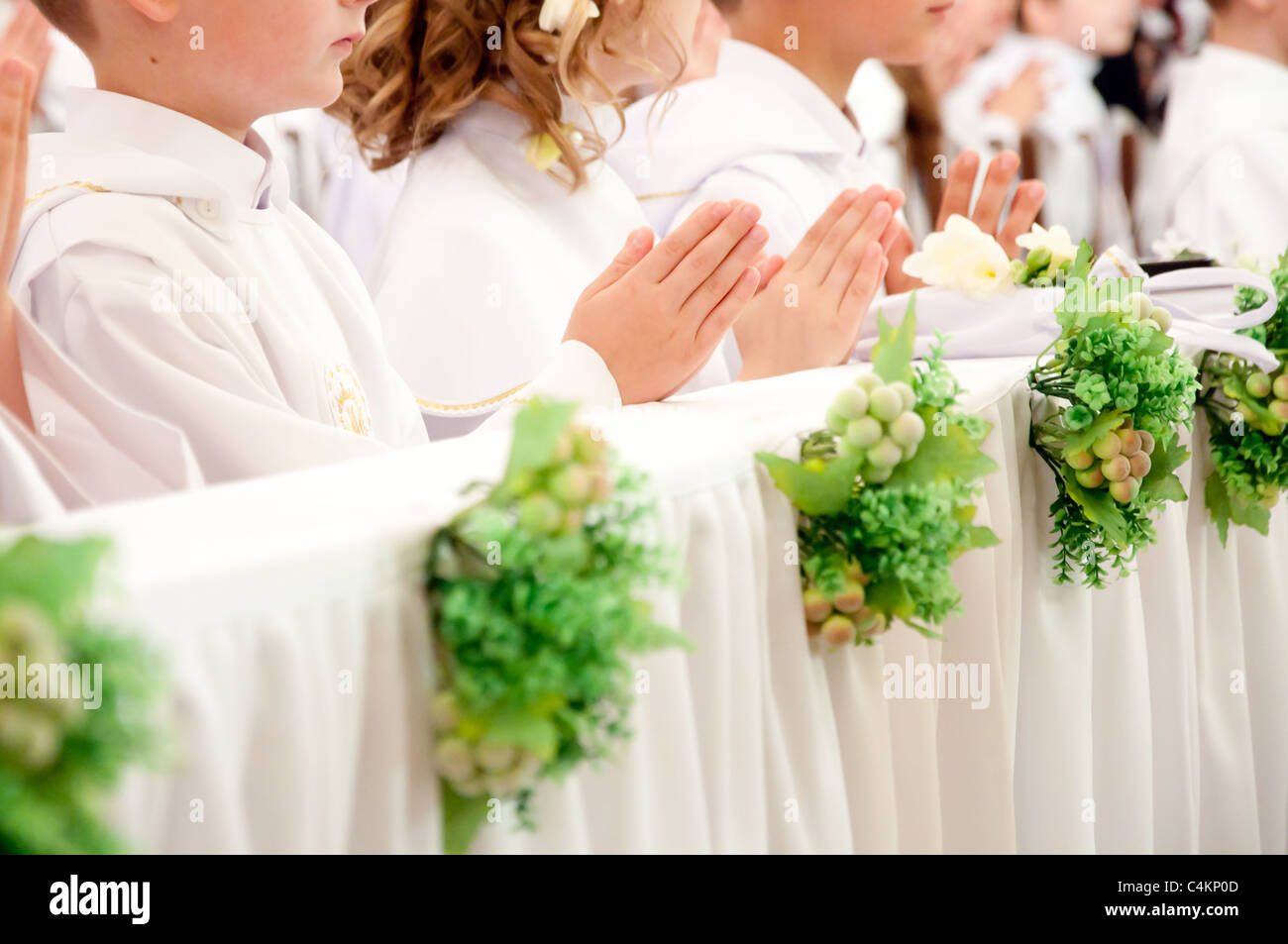 children accepting the first Holy Communion Stock Photo - Alamy