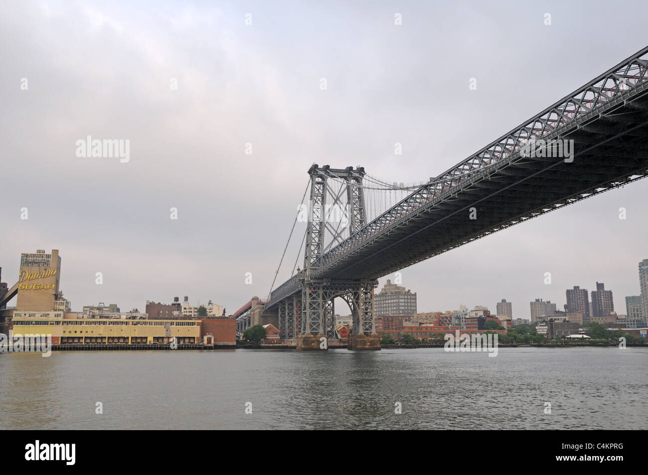 The Williamsburg Bridge (1903) spans the East River, connecting the New ...