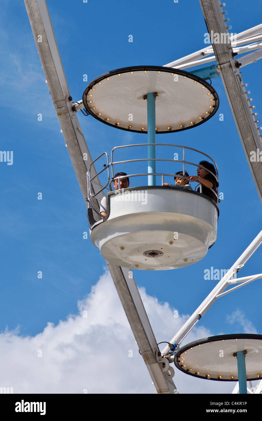 Fairground ferris wheel ride, single car with canopy Stock Photo - Alamy