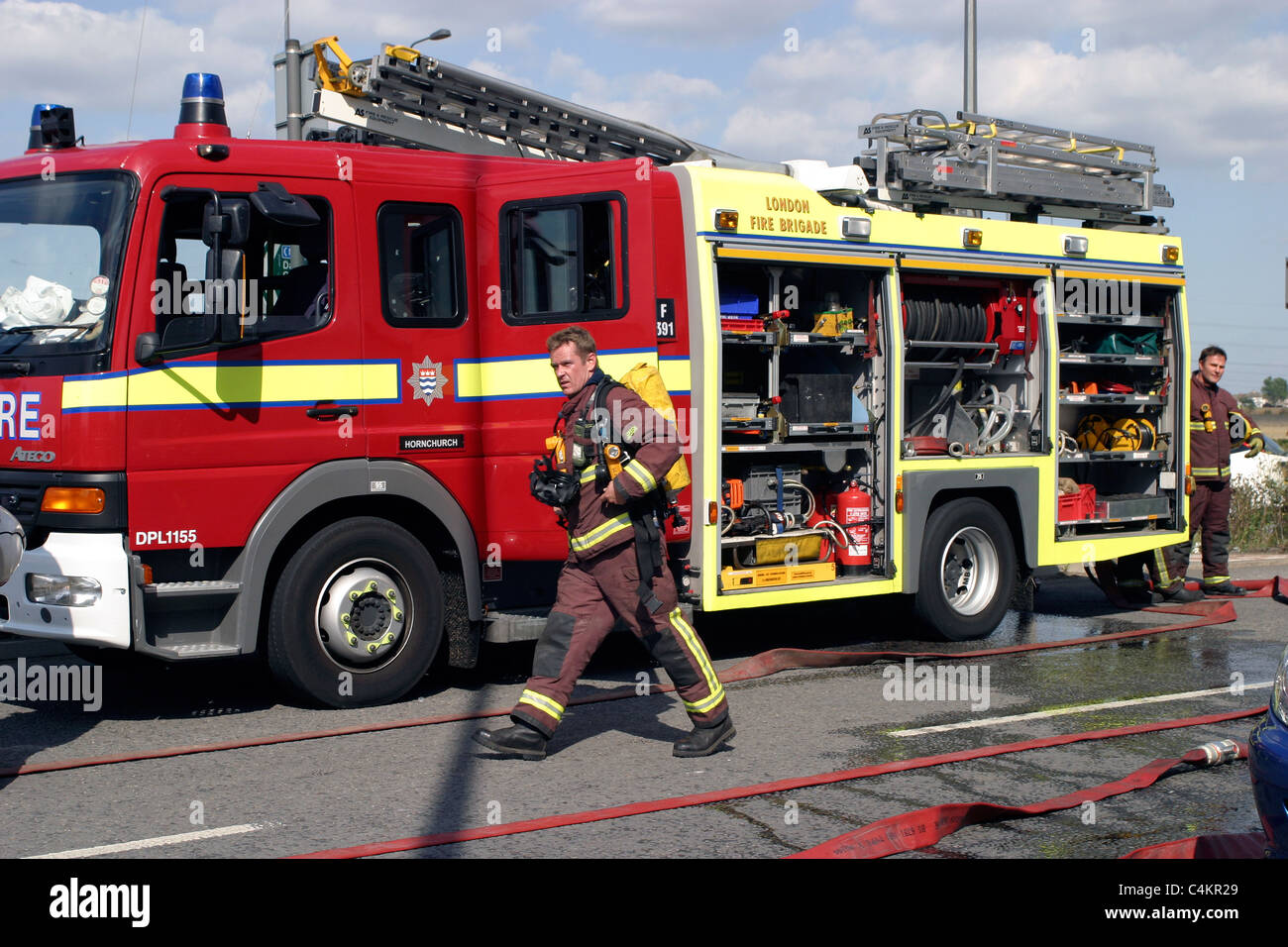 Firefighter at scene of a large fire in London Stock Photo - Alamy
