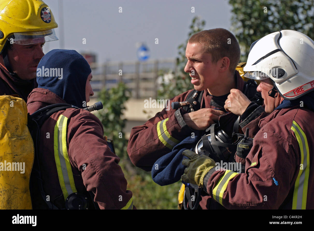 Firefighters preparing to tackle a fire Stock Photo - Alamy