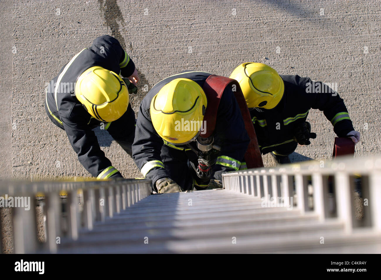 Firefighters climb ladder hi-res stock photography and images - Alamy