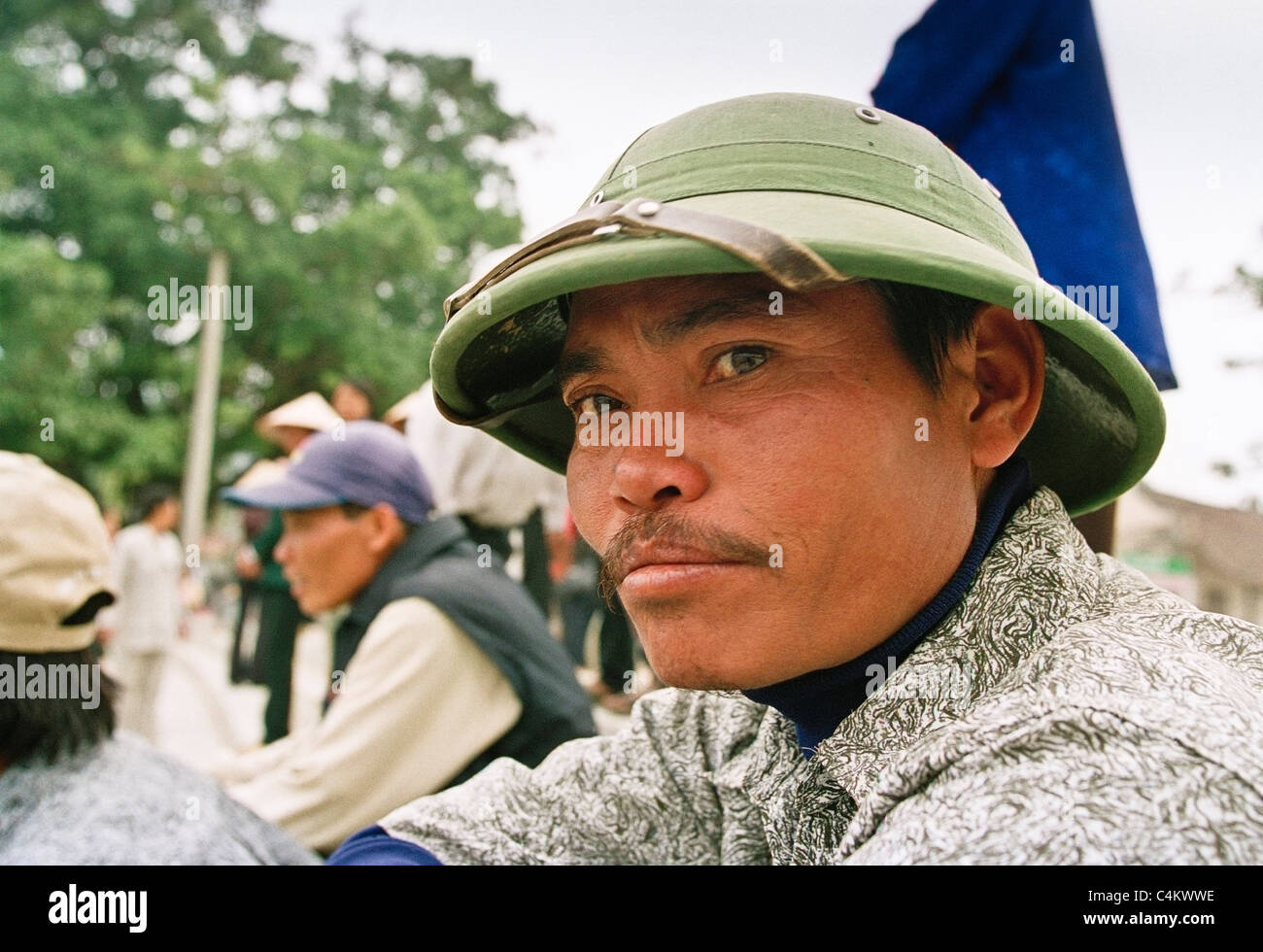 Vietnamese man wearing a solar topee Stock Photo - Alamy
