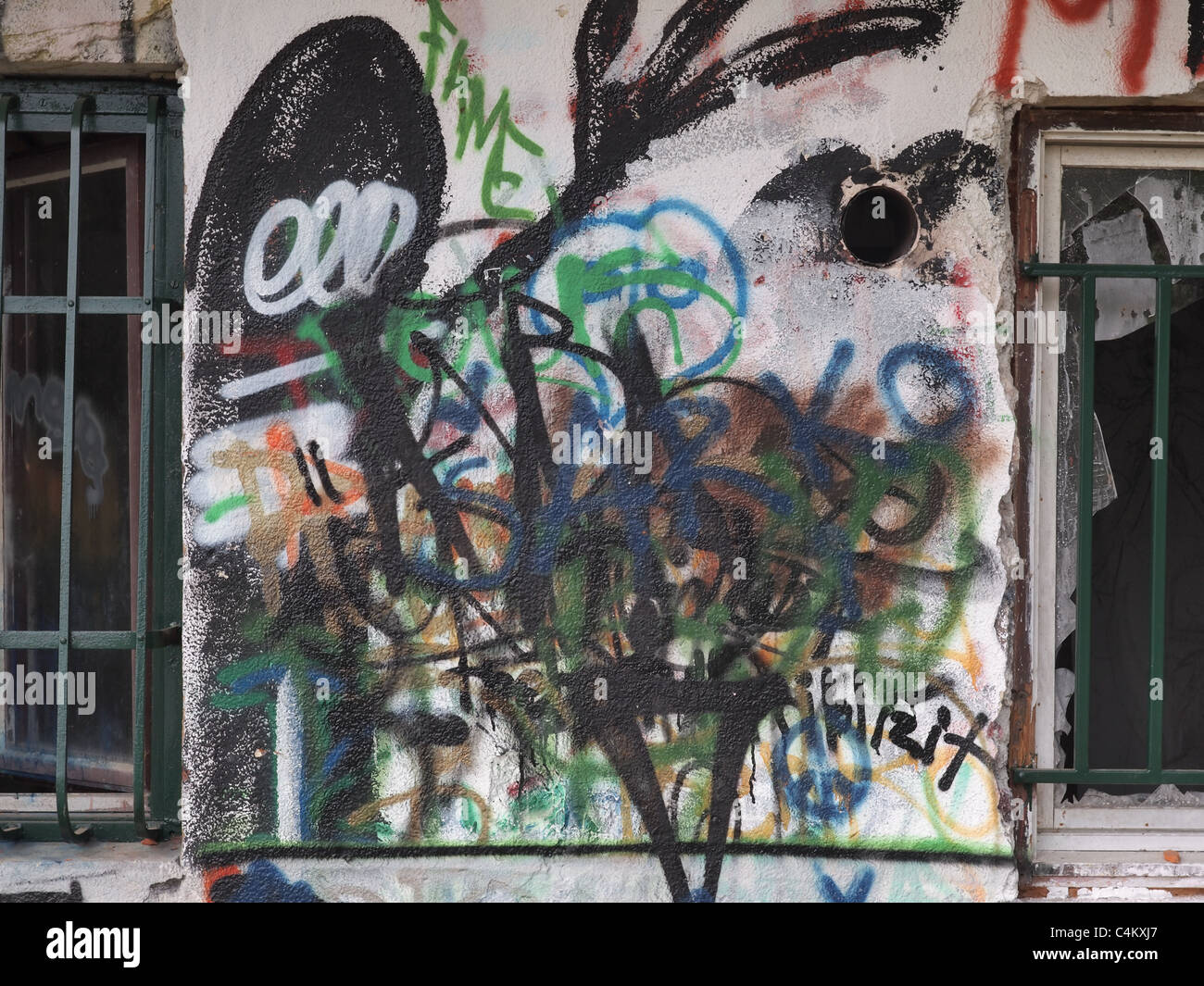 Broken window and graffiti wall Stock Photo - Alamy
