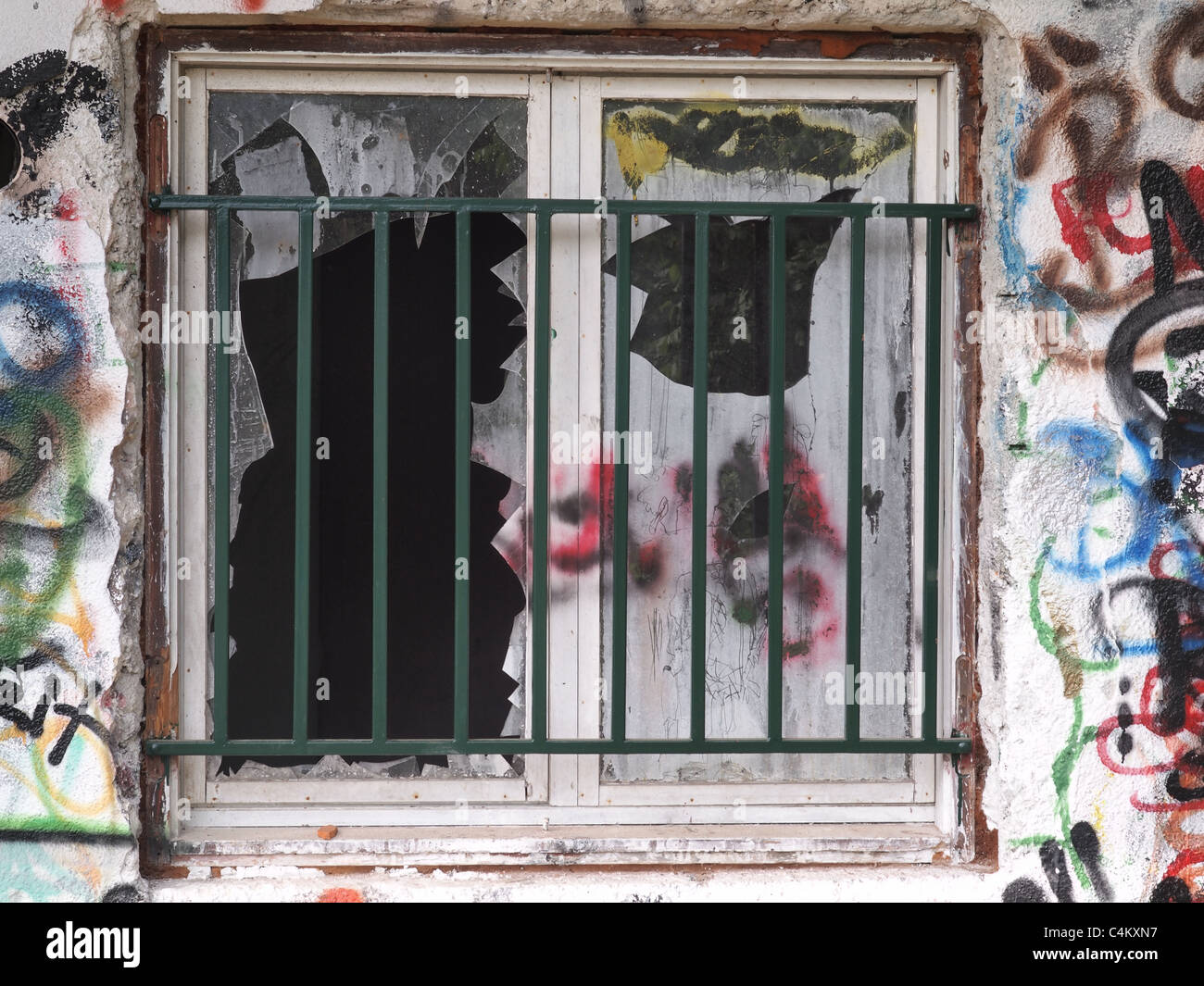 Broken window and graffiti wall Stock Photo - Alamy