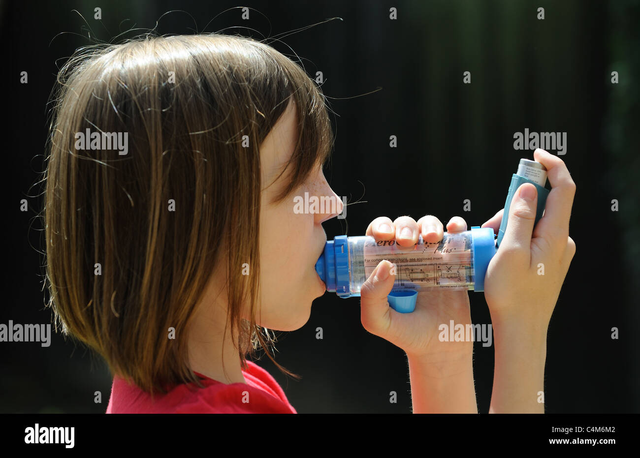 Young Asthma patient using an inhaler Stock Photo - Alamy