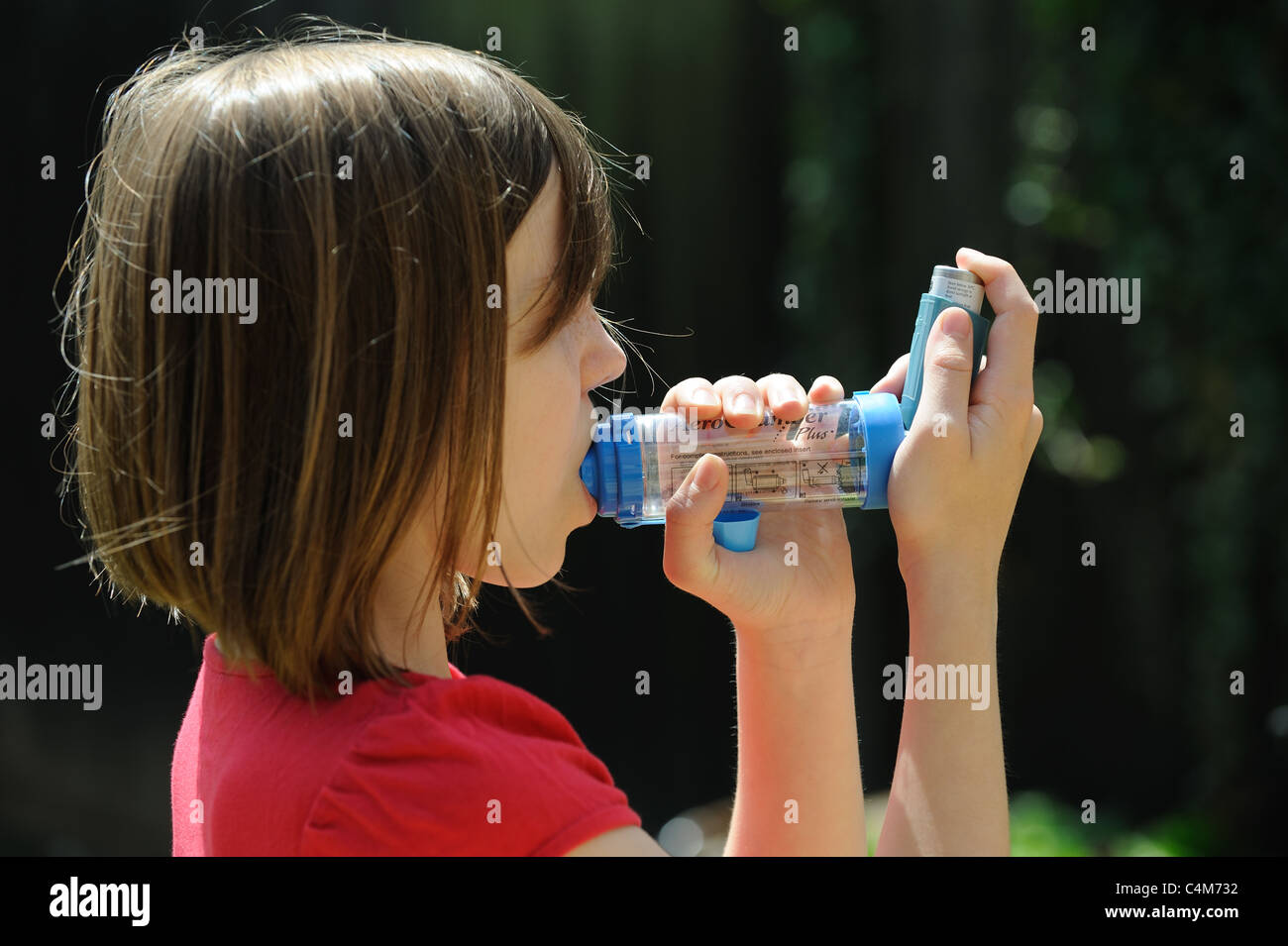 Young Asthma patient using an inhaler Stock Photo - Alamy