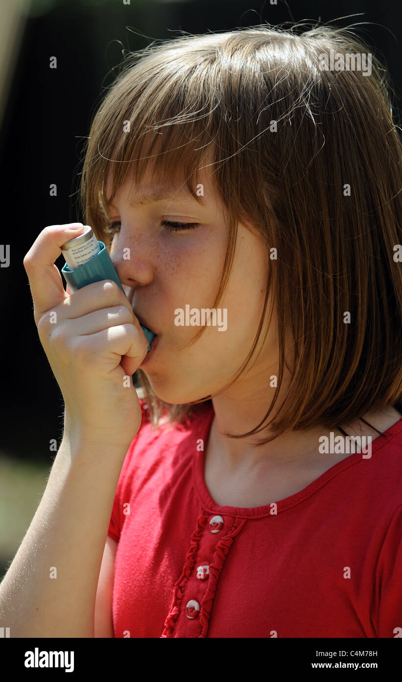 Young Asthma patient using an inhaler Stock Photo - Alamy