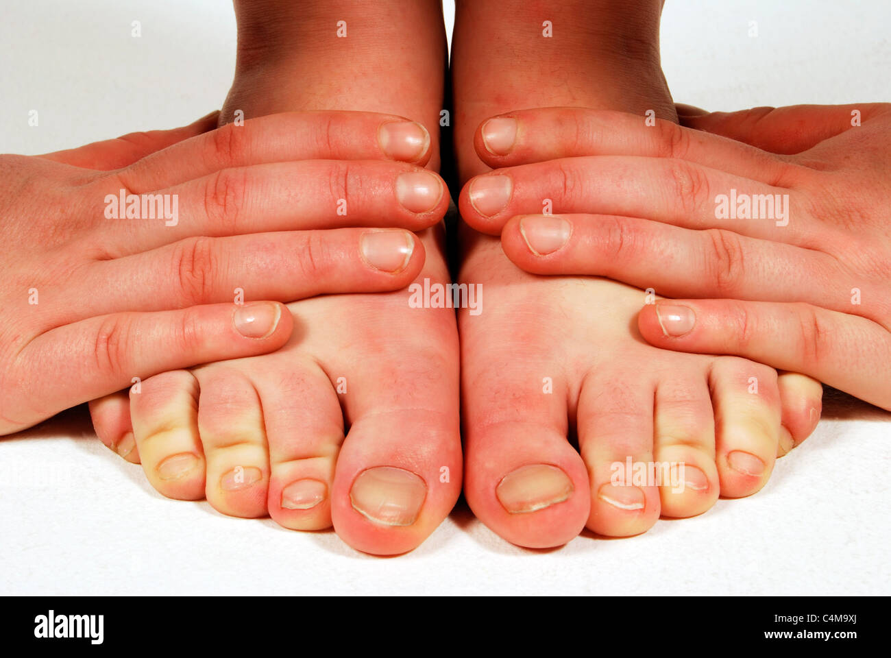 Hands On Feet Stock Photo Alamy Hands On Feet Stock Photo Alamy