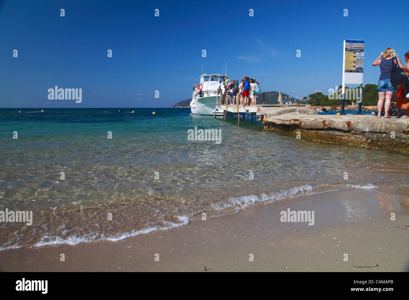 Ferryboat at the beach of Cala Pada, Ibiza, Spain Stock Photo - Alamy