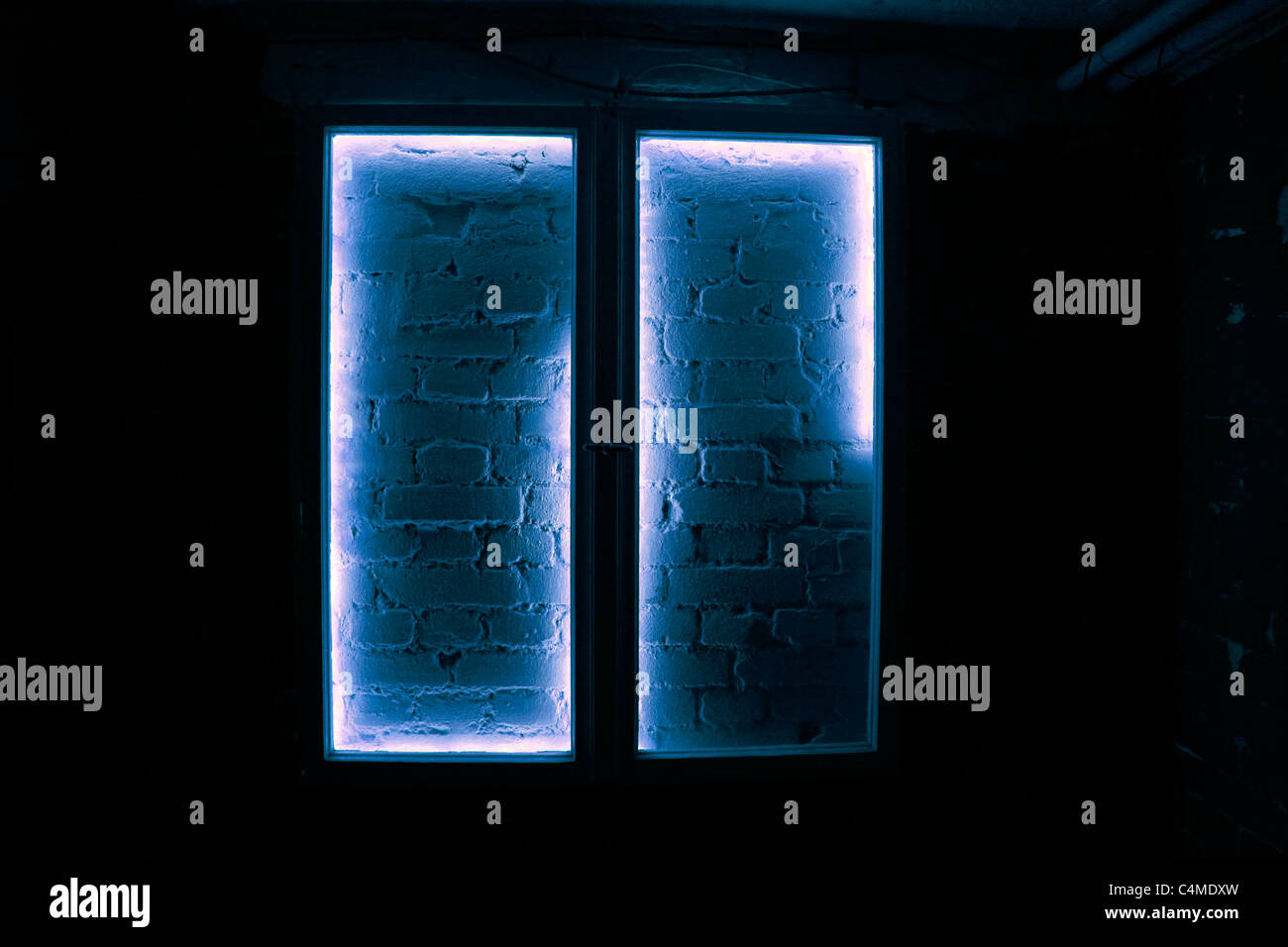 A blocked up window with bricks Stock Photo - Alamy