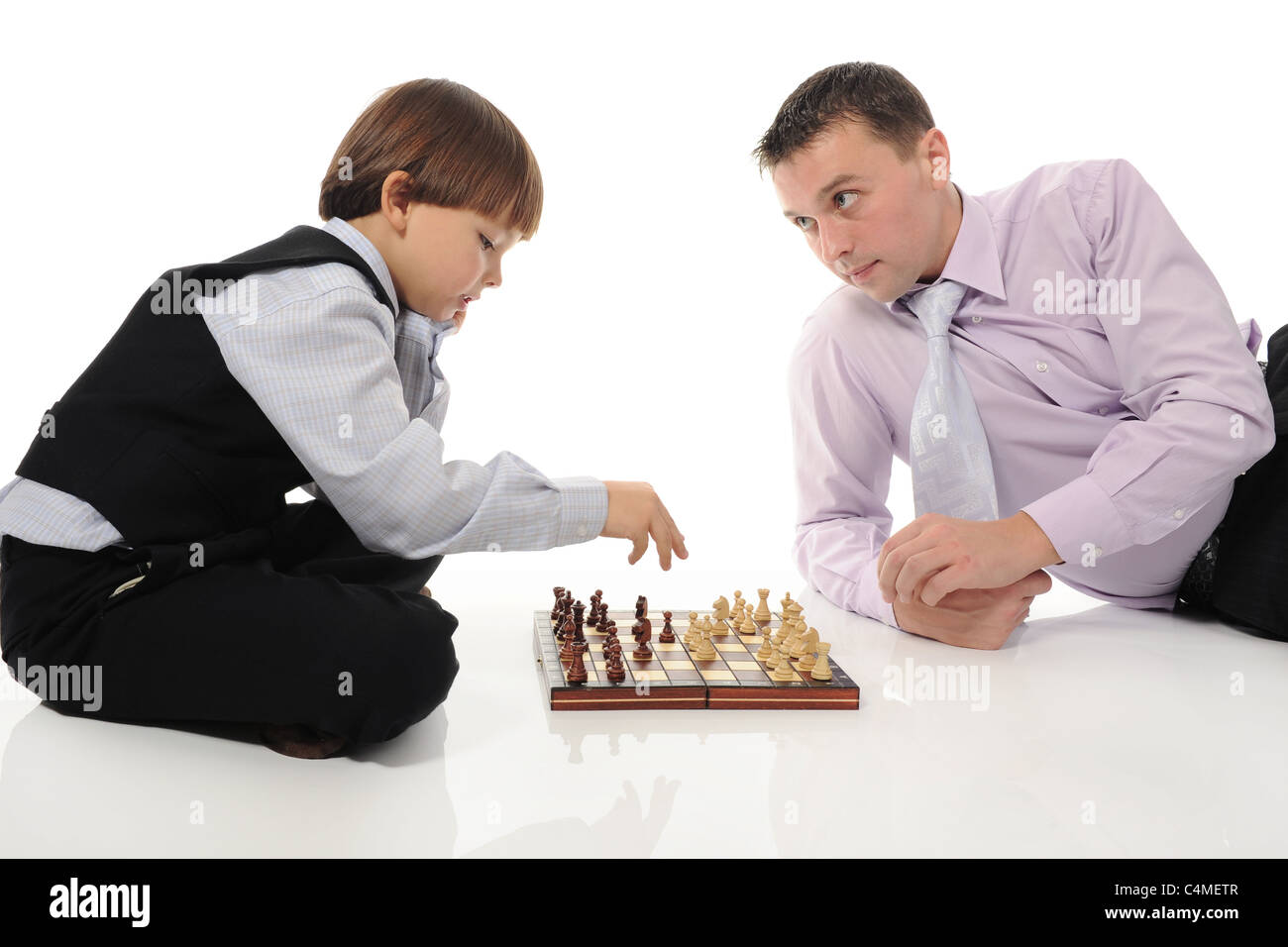 Dad and son playing chess Stock Photo - Alamy