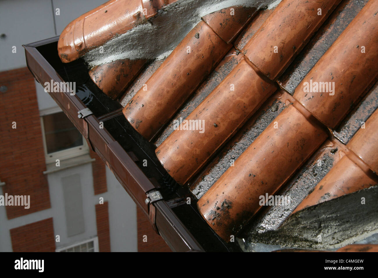 rain falling on wet terracotta roof tiles of house home property Stock ...