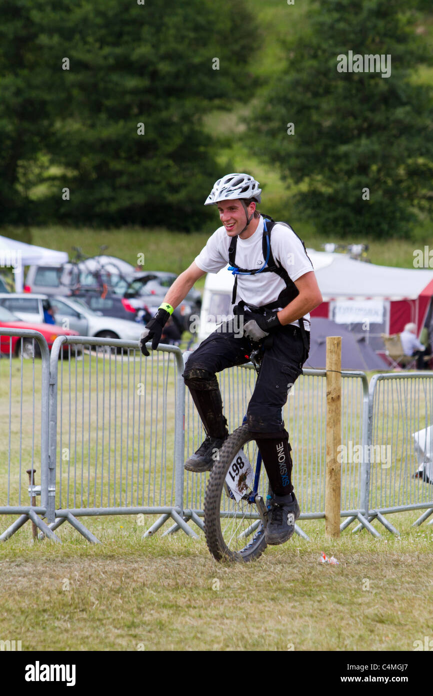 A unicyclist competing at Mountain Mayhem 2011 Stock Photo - Alamy