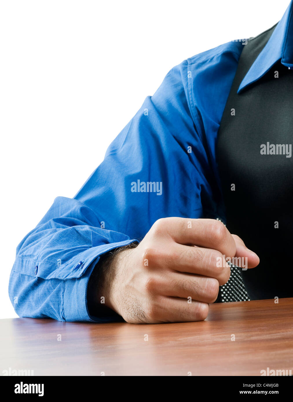 Close up of a hand and shoulder of a professional man sitting at a desk ...