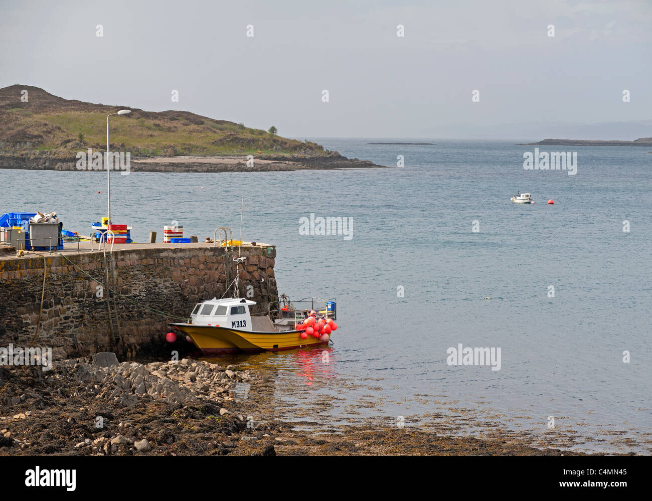 Small fish landing Pier or Jetty on the Ross of Mull, Argyll. Scotland ...