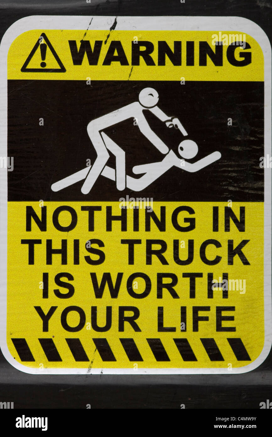 A Warning sign not to break in to the vehicle Stock Photo - Alamy
