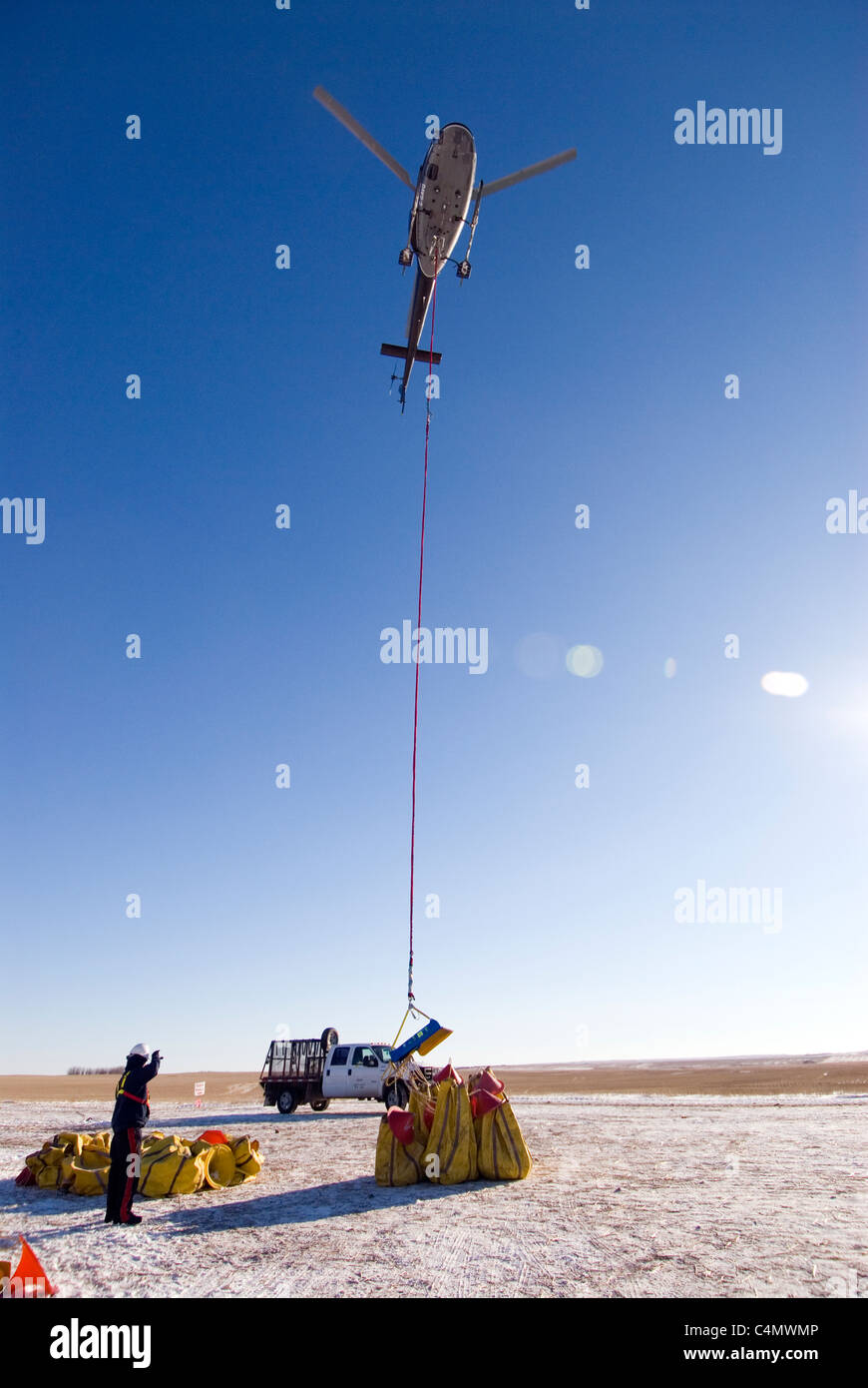 Helicopter lifting seismic cables for oil & natural gas exploration ...