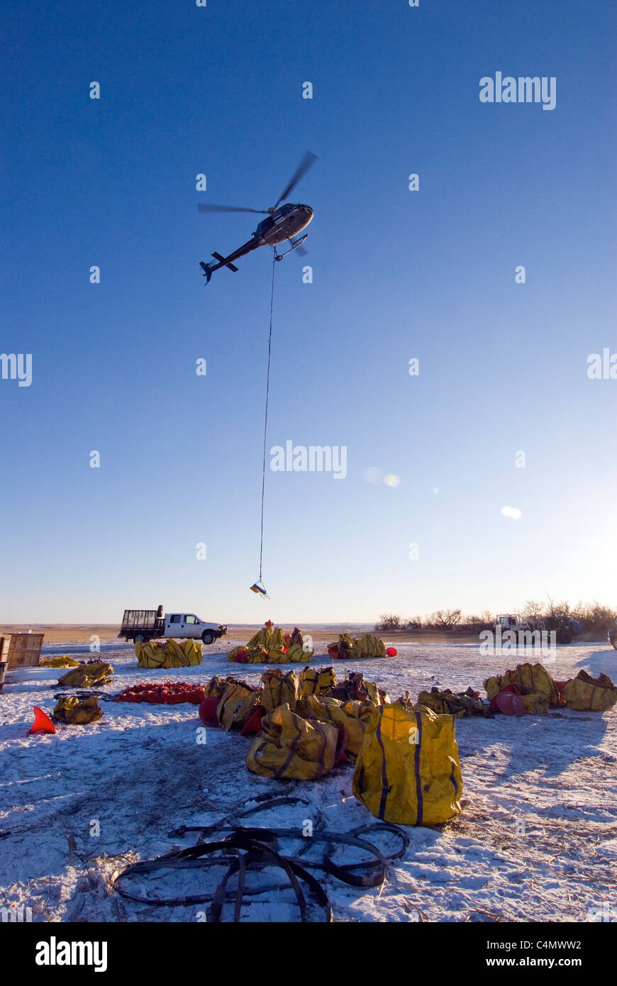 Helicopter lifting seismic cables for oil & natural gas exploration ...