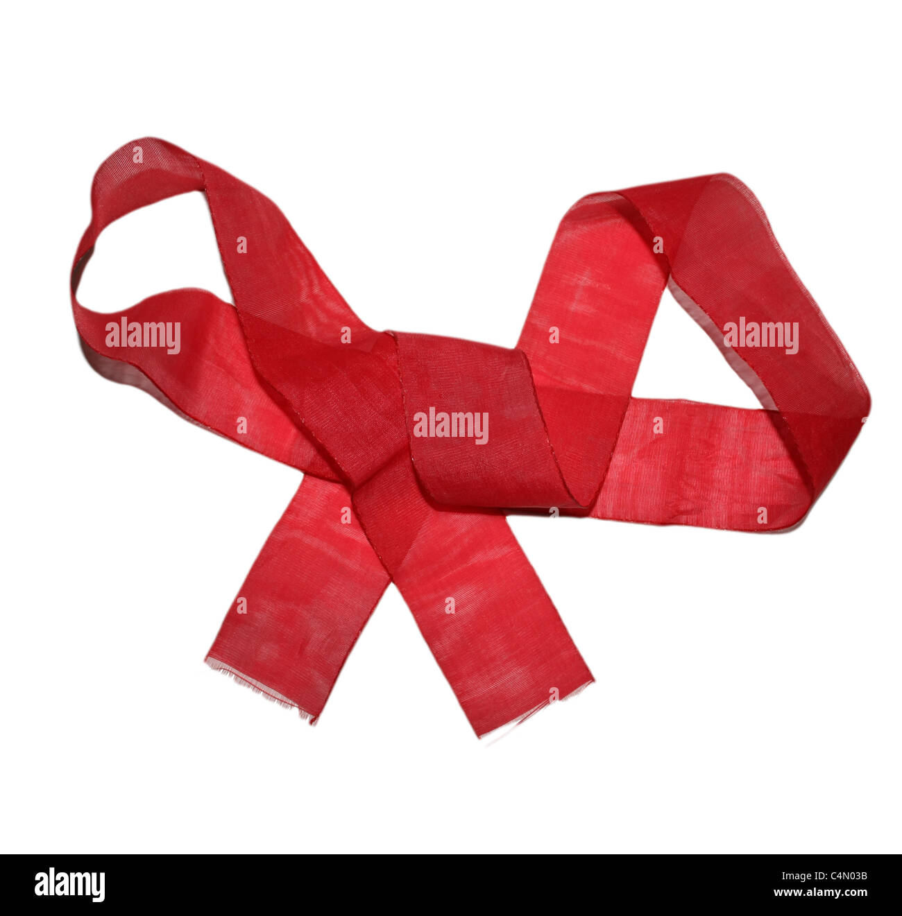 A red ribbon wound around in the shape of a tie Stock Photo - Alamy