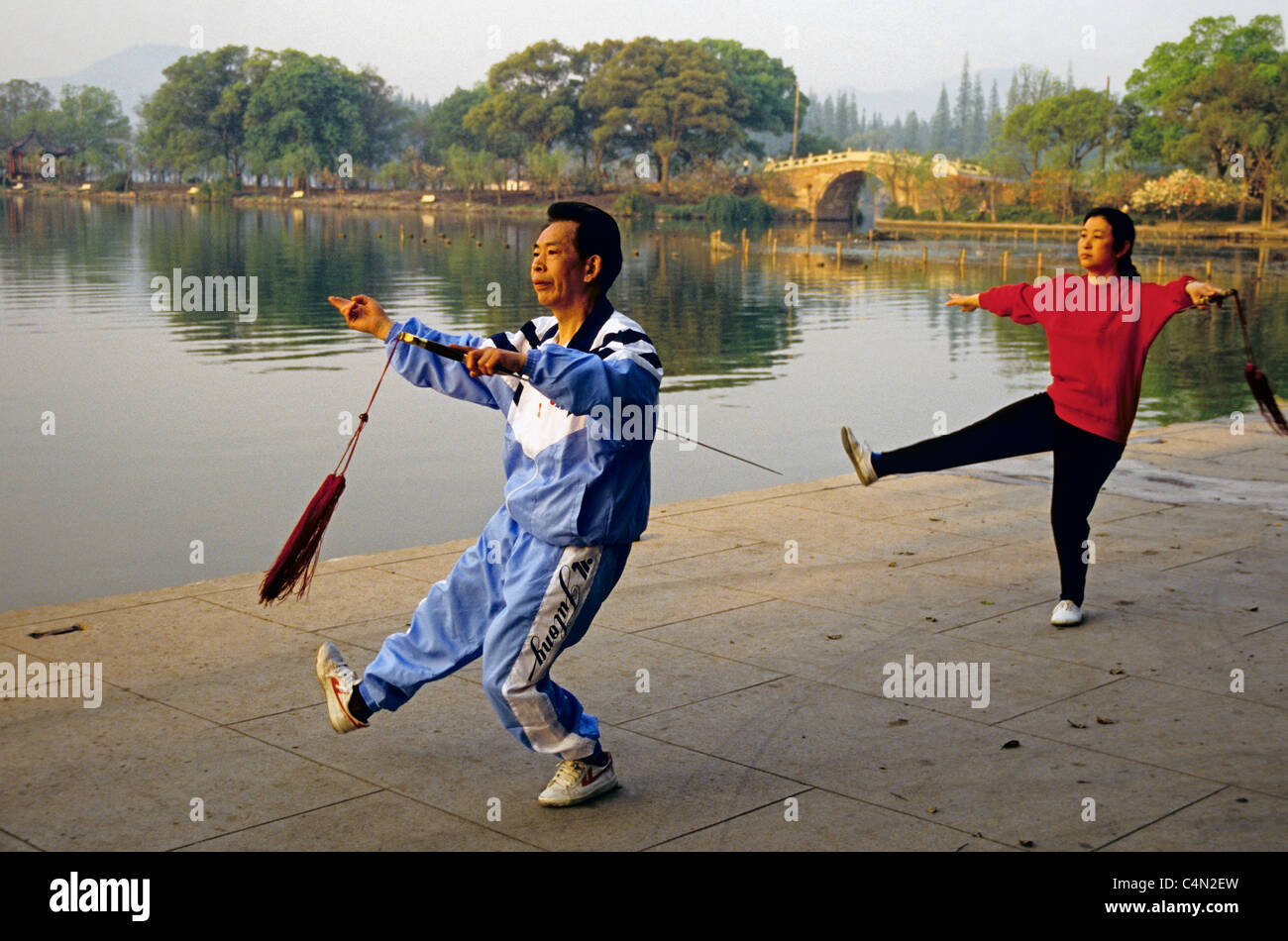 Morning sword exercise (martial art) beside West Lake in Hangzhou Stock ...