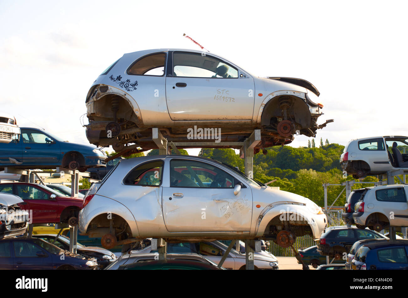 Cars stacked up in a scrapyard Stock Photo - Alamy