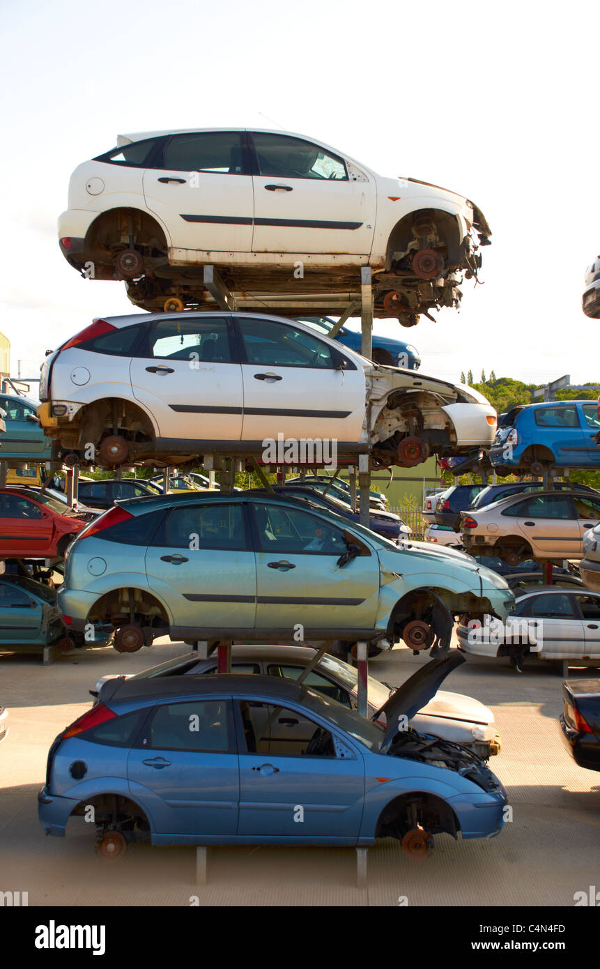 Cars stacked up in a scrapyard Stock Photo - Alamy