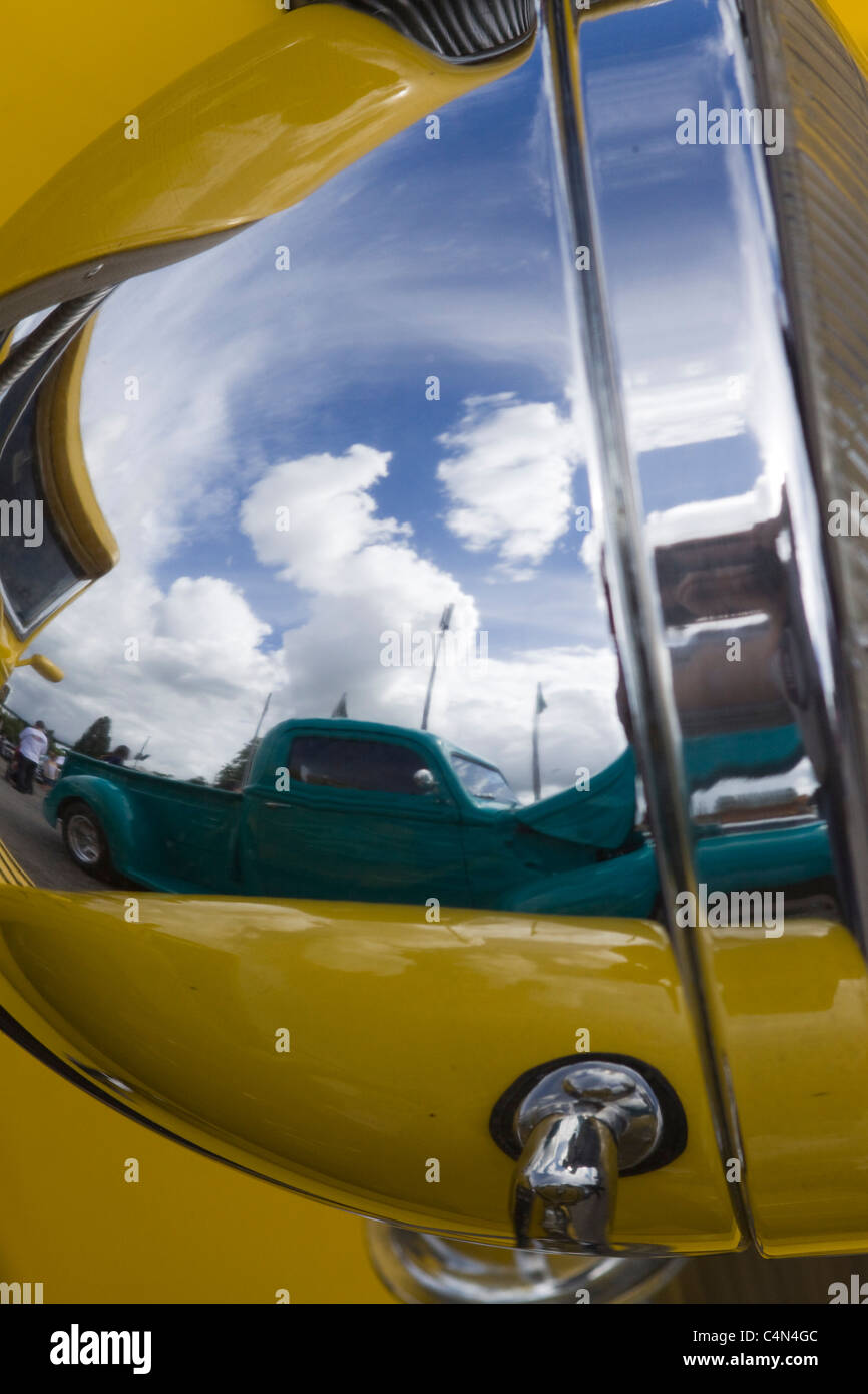 Reflection in a head light of a custom car Stock Photo - Alamy