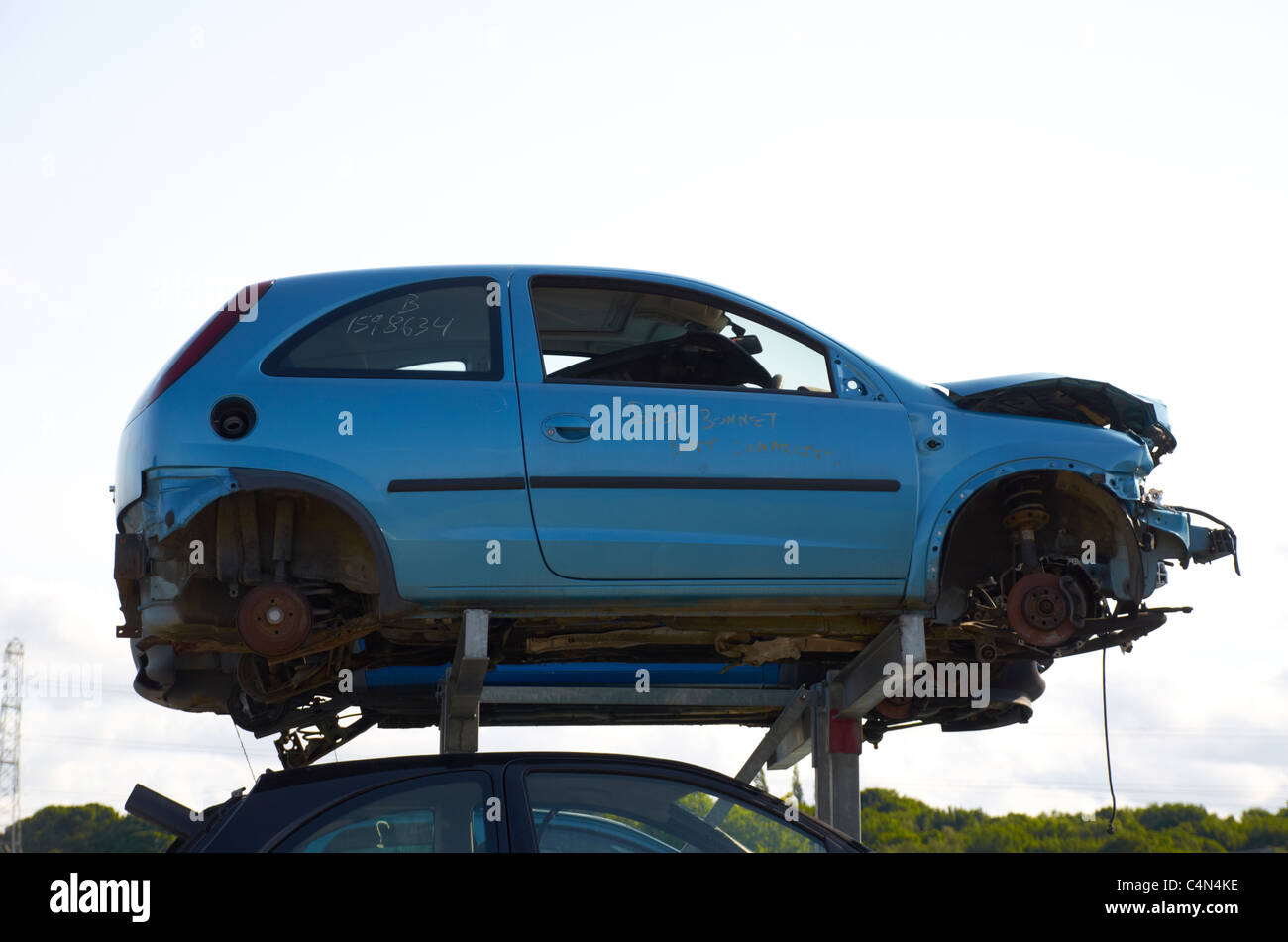 Cars stacked up in a scrapyard Stock Photo - Alamy