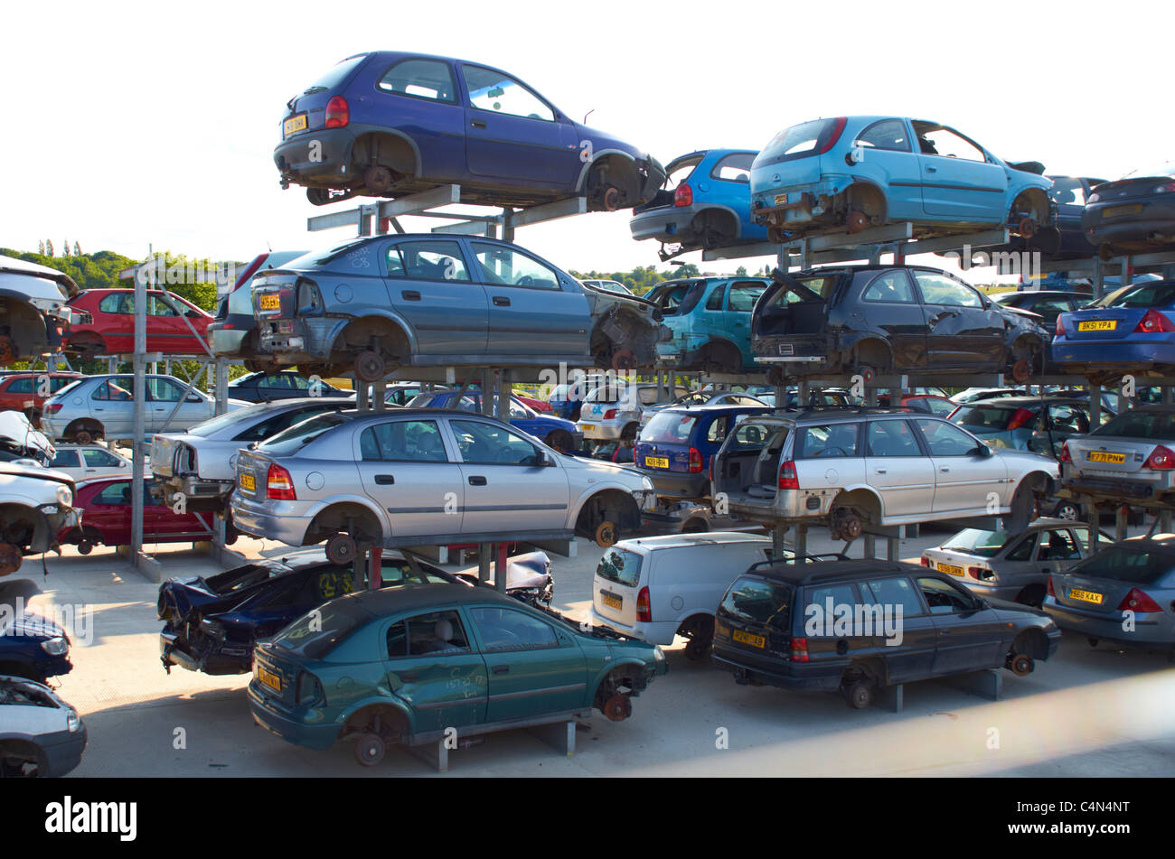 Cars stacked up in a scrapyard Stock Photo - Alamy