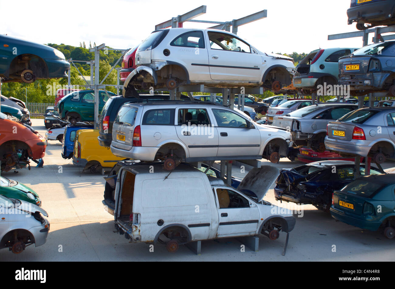 Cars stacked up in a scrapyard Stock Photo - Alamy