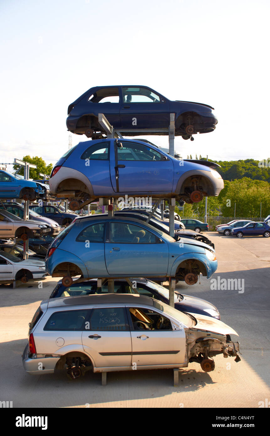 Cars stacked up in a scrapyard Stock Photo - Alamy