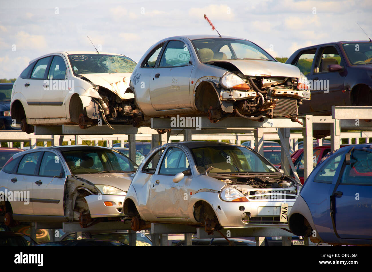 Cars stacked up in a scrapyard Stock Photo - Alamy