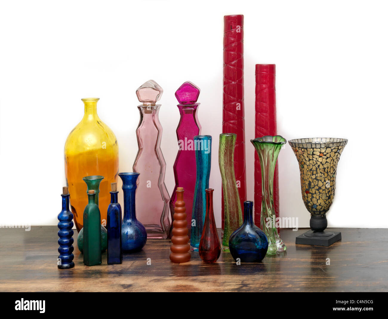 A Collection Different Coloured And Shapes Bottles And Vases Made From ...