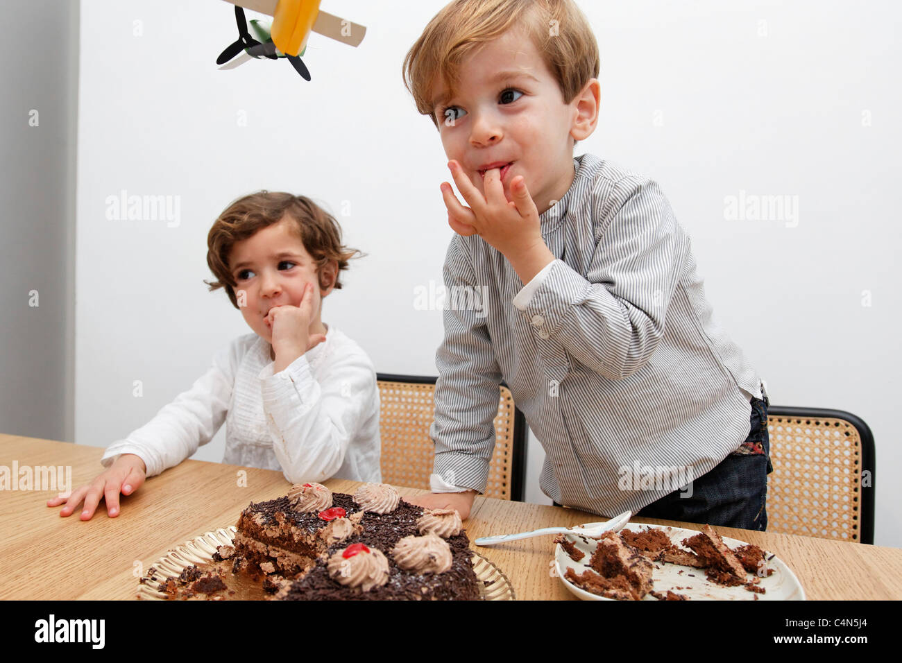 A birthday cake for two young children Stock Photo - Alamy