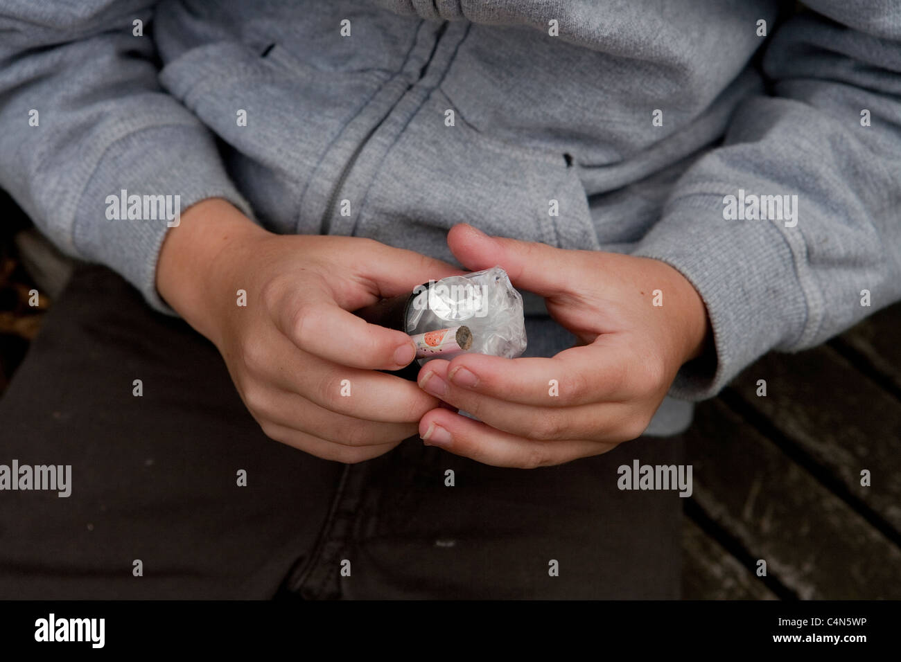 Boy holding an open micro-cache Stock Photo - Alamy