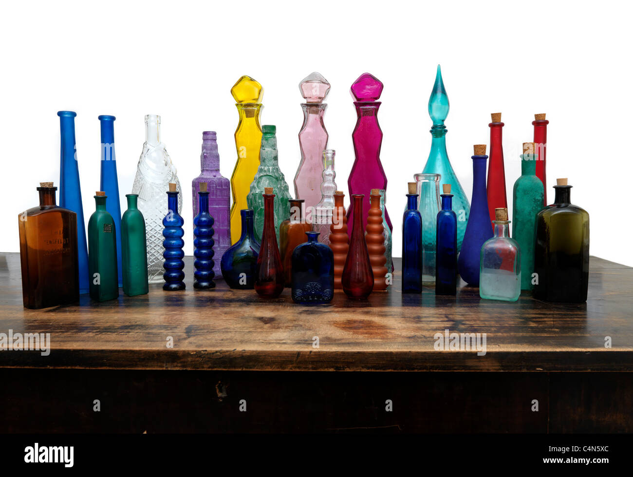 A Collection Of Glass Bottles All Different Shapes, Sizes And Colours ...