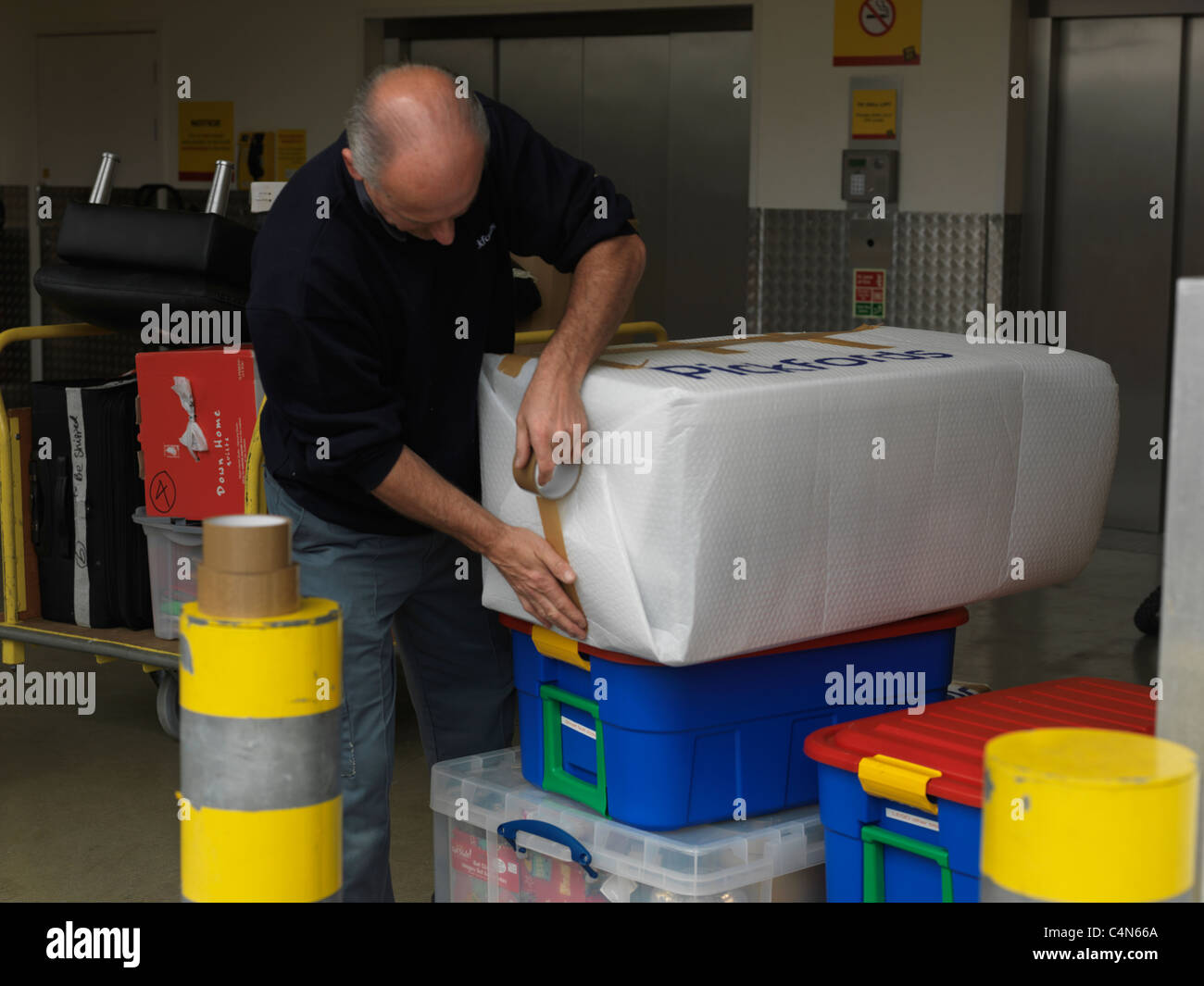 Man Packing Things Up In Boxes To Put In Storage England Stock Photo ...