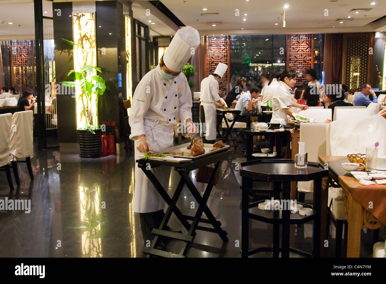 Beijing, China, interior chinese restaurant china, Waiter in Uniform ...
