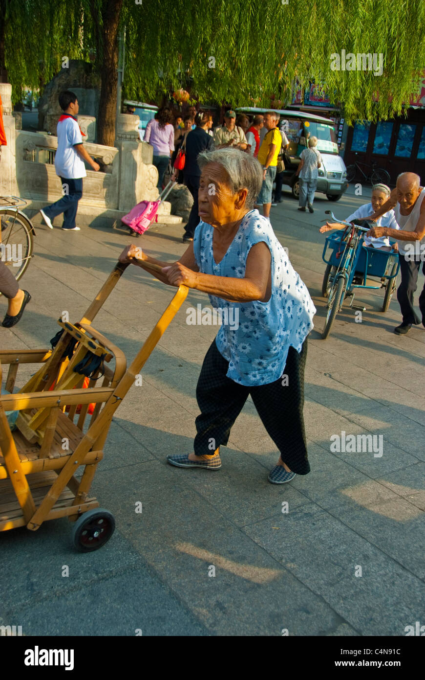 Beijing, China, Old Woman Pushing Shopping Cart, Chinese city street ...