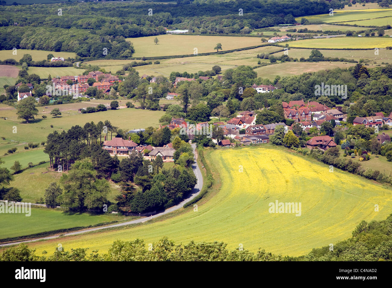 Nucleated spring line village of Poynings set in the clay farmland of ...