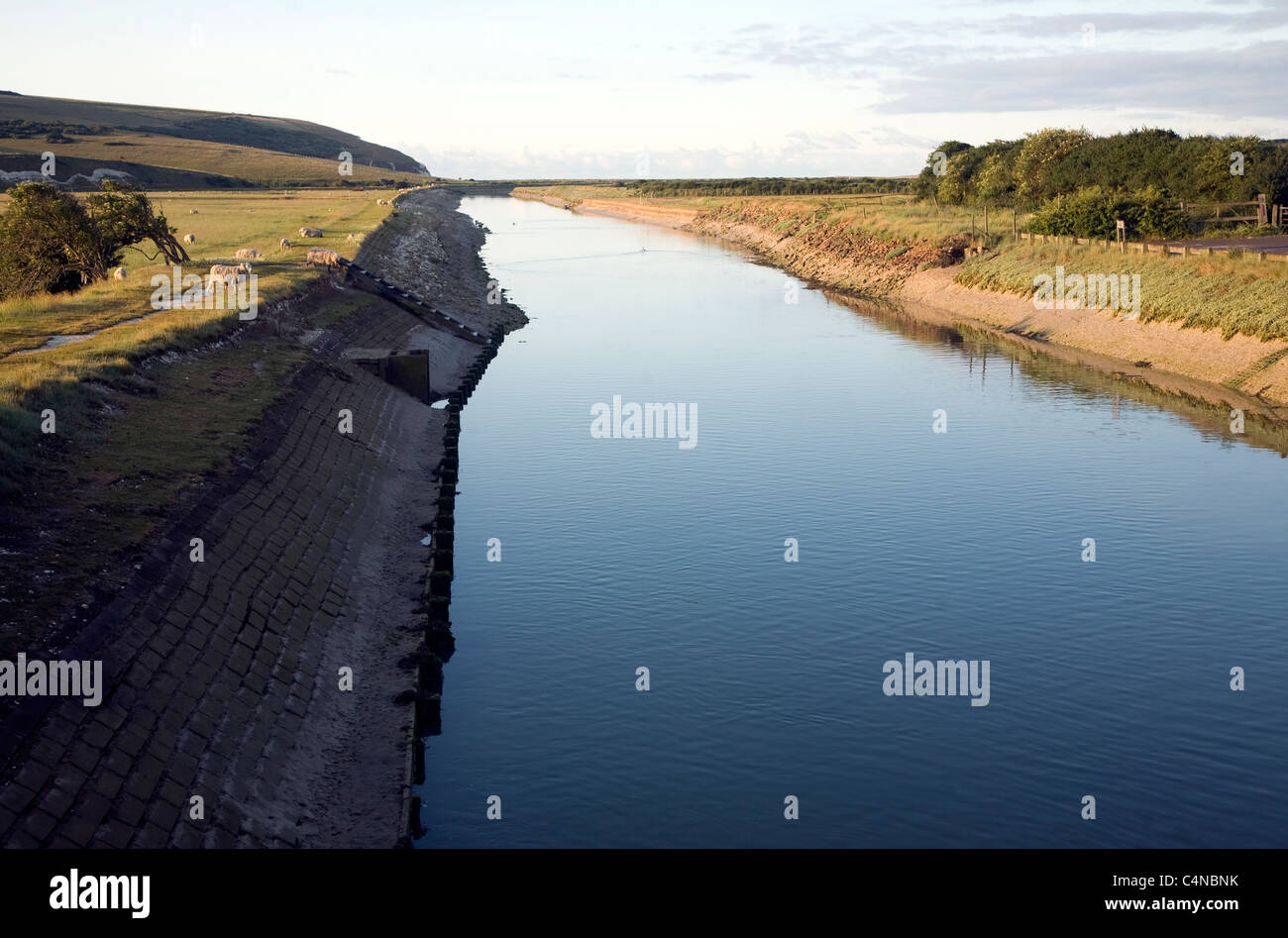 Straightened concrete lined channel of River Cuckmere as it nears its ...