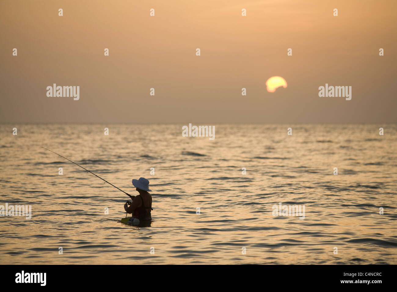 Woman fishing in the ocean at sunset, Sarasota, Florida Stock Photo - Alamy
