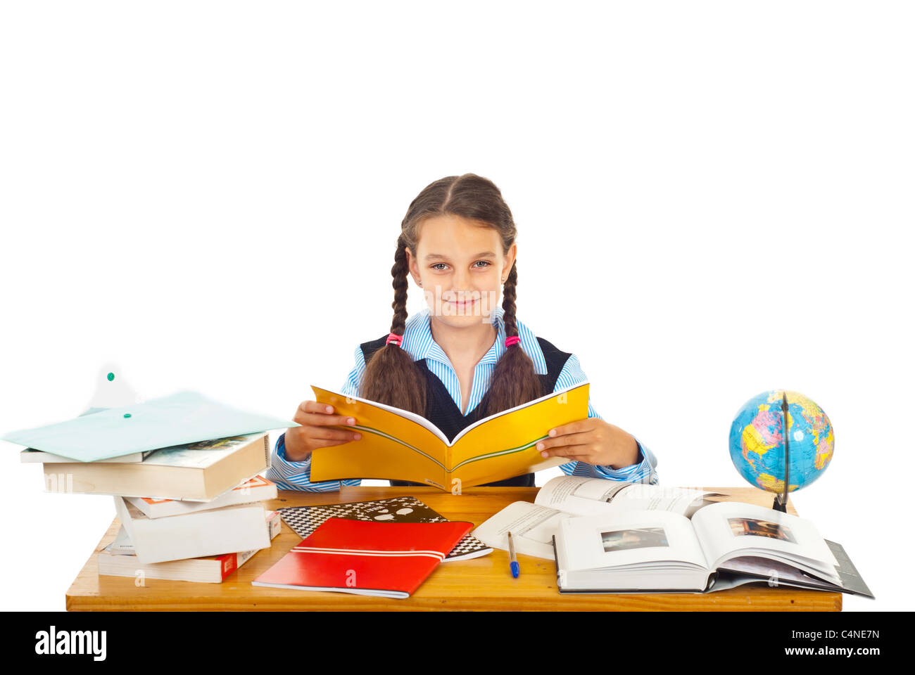 Student girl doing homework and reading from a notebook isolated on ...