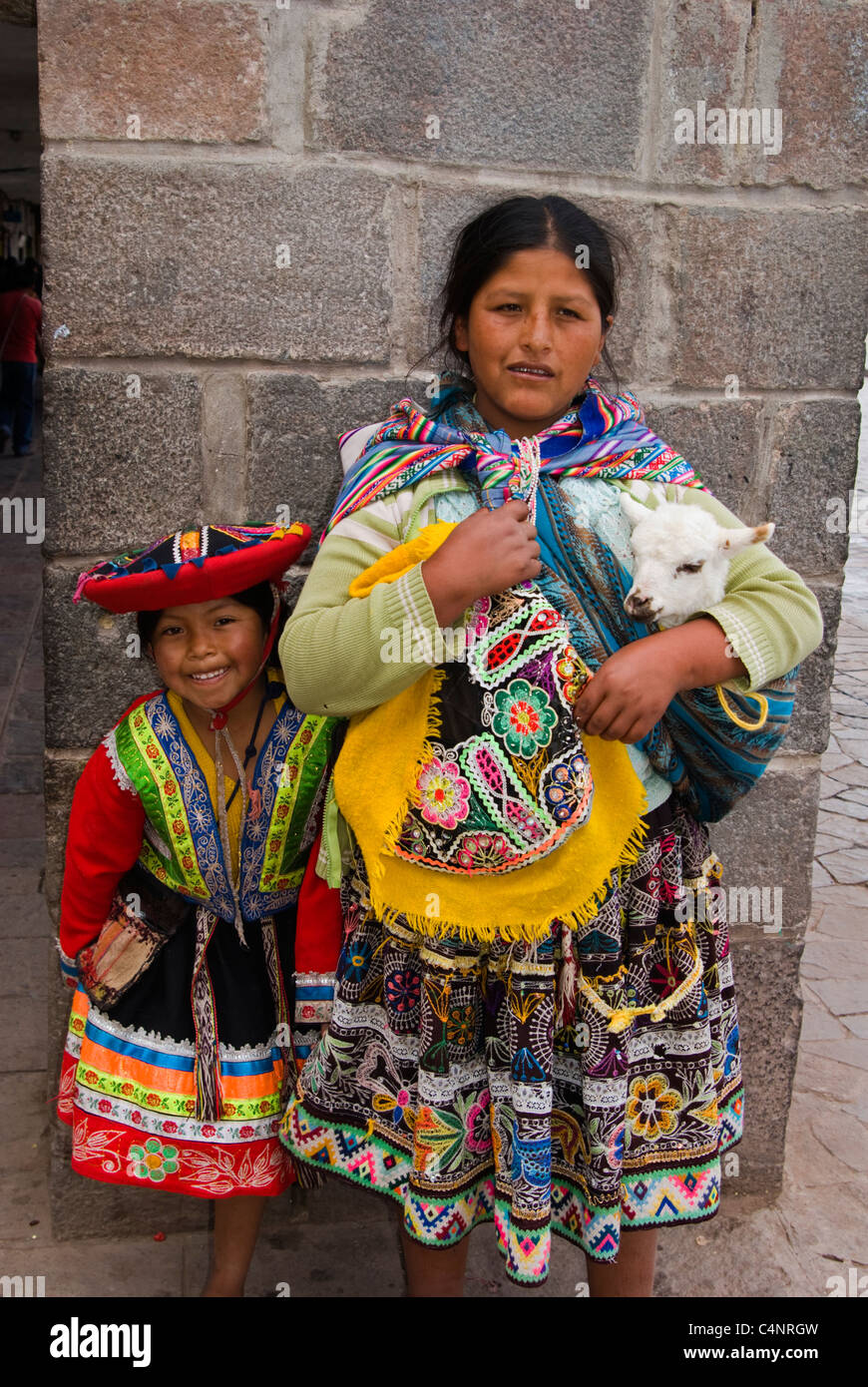Mother and child with lamb, Cusco, Peru Stock Photo - Alamy