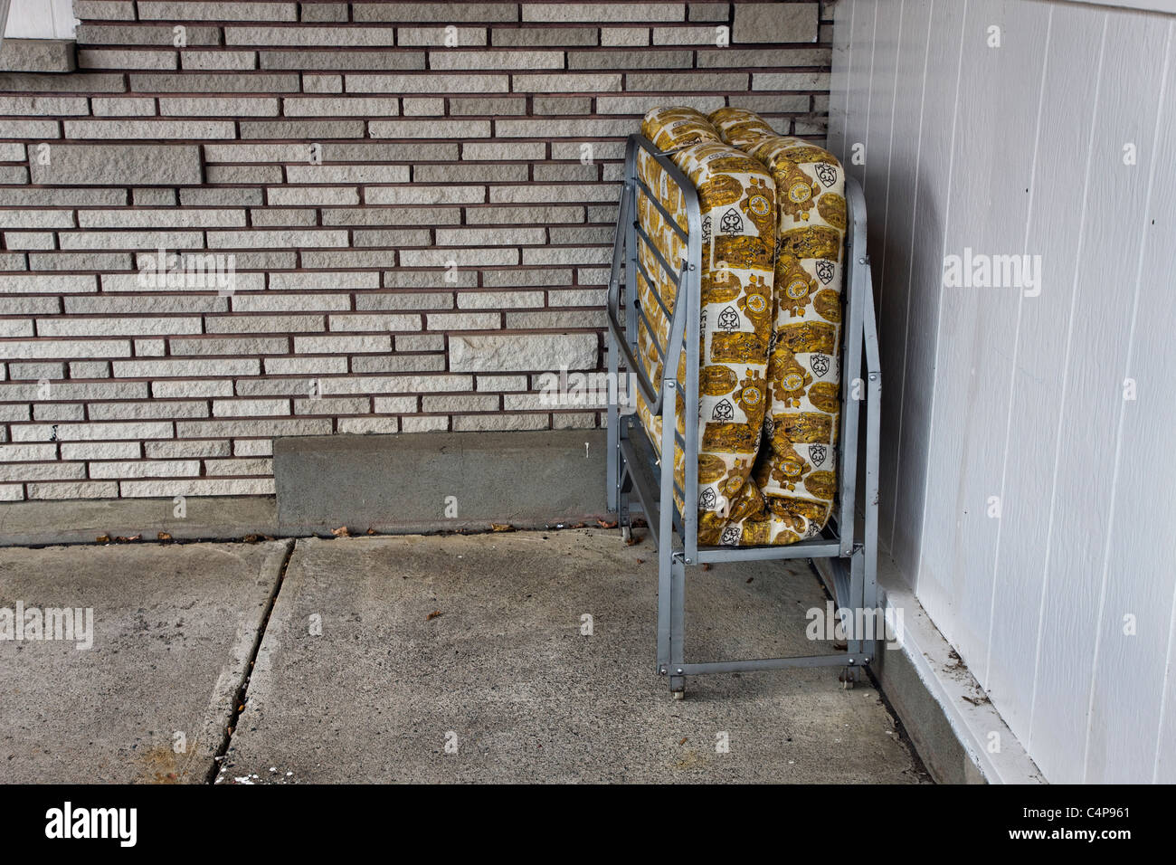 Fold up bed in folded position Stock Photo - Alamy
