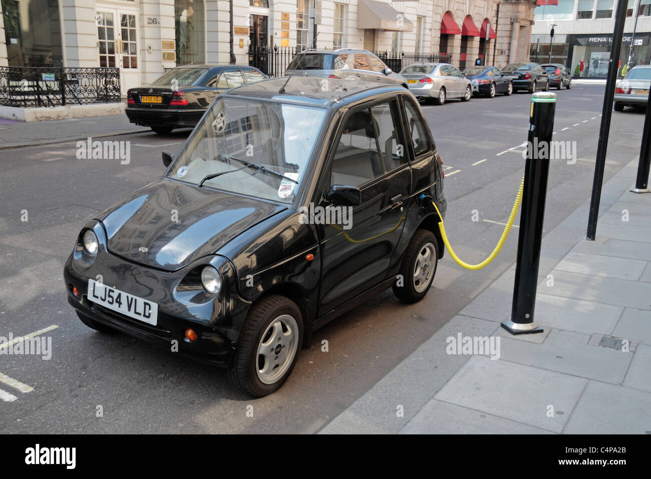 An electric G Wiz car being charged at a Elektrobay on-street ...