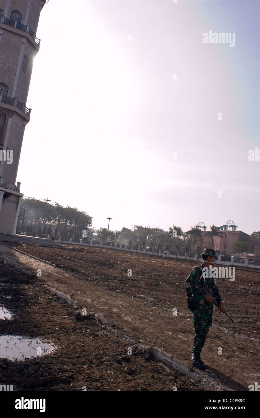 A member of the Indonesian military stands guard n the grounds of the ...